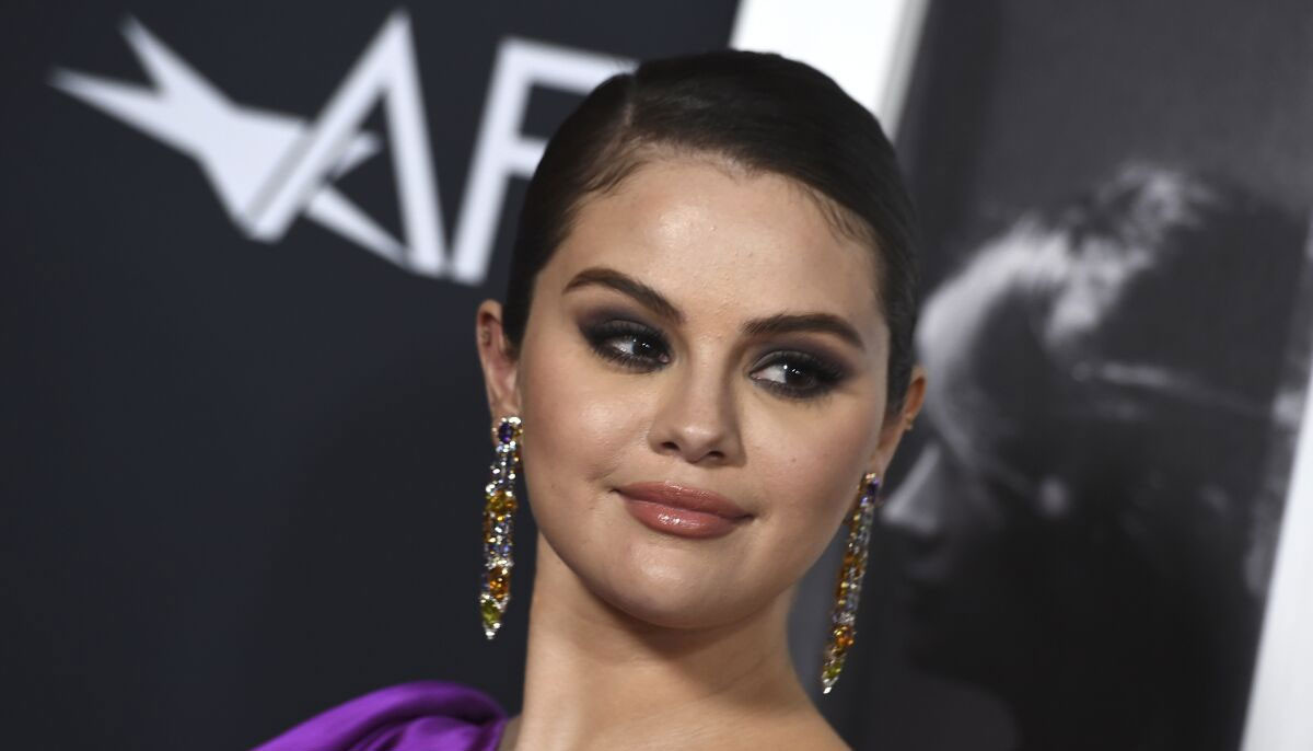 Selena Gomez puts her bold red lips on display