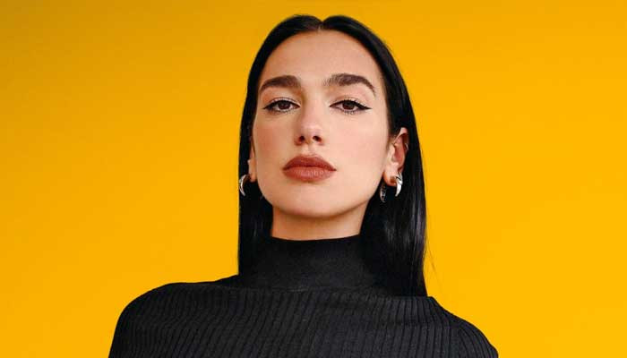 Dua Lipa stuns in sheer lace mini dress at exclusive London pop-up launch